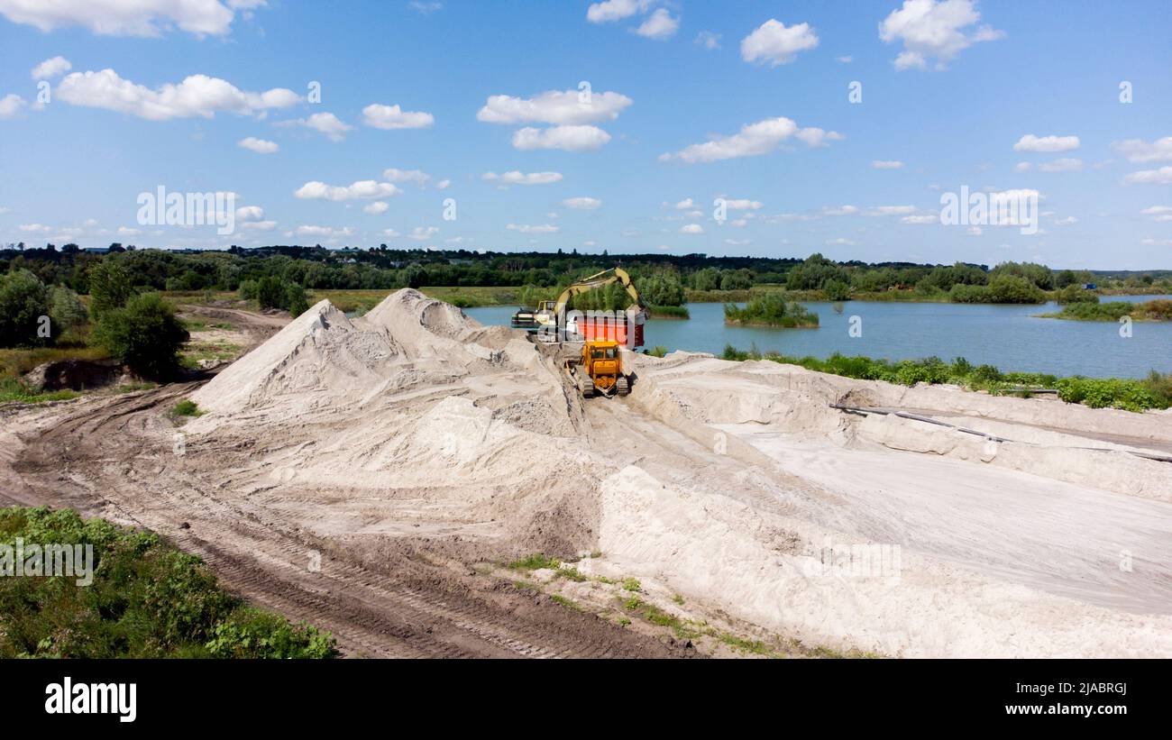 Aerial drone view flight over sand mining. Sand quarry. Top view. Lake ...