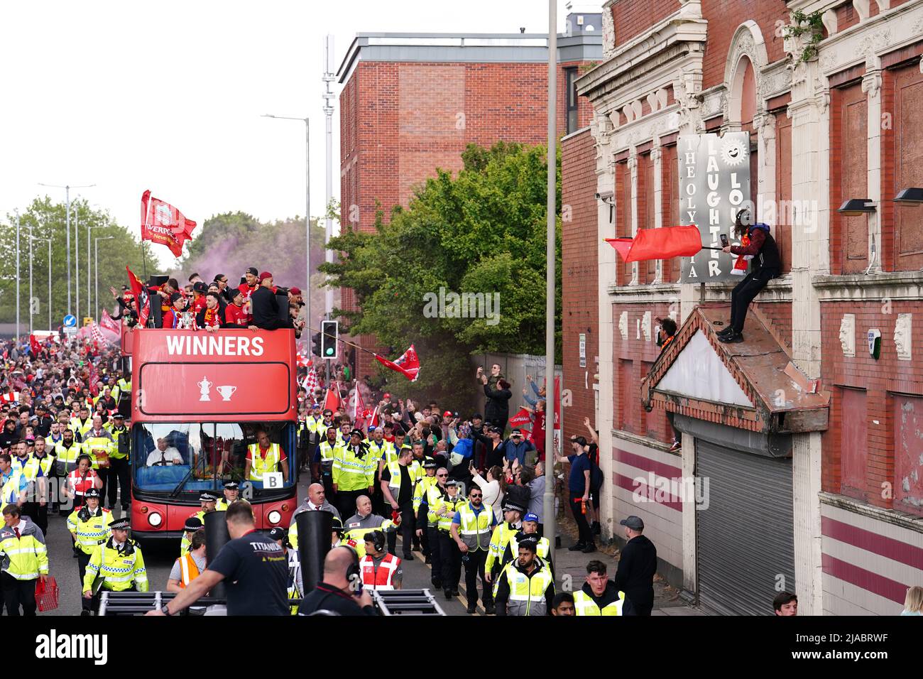 Liverpool players on an open-top bus during the trophy parade in ...