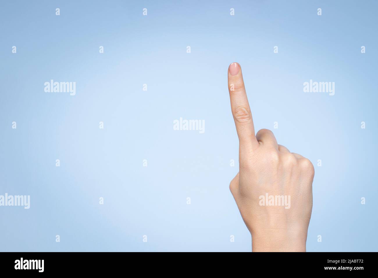 Hand gesture. Female hand shows number one. Woman pointing up with ...