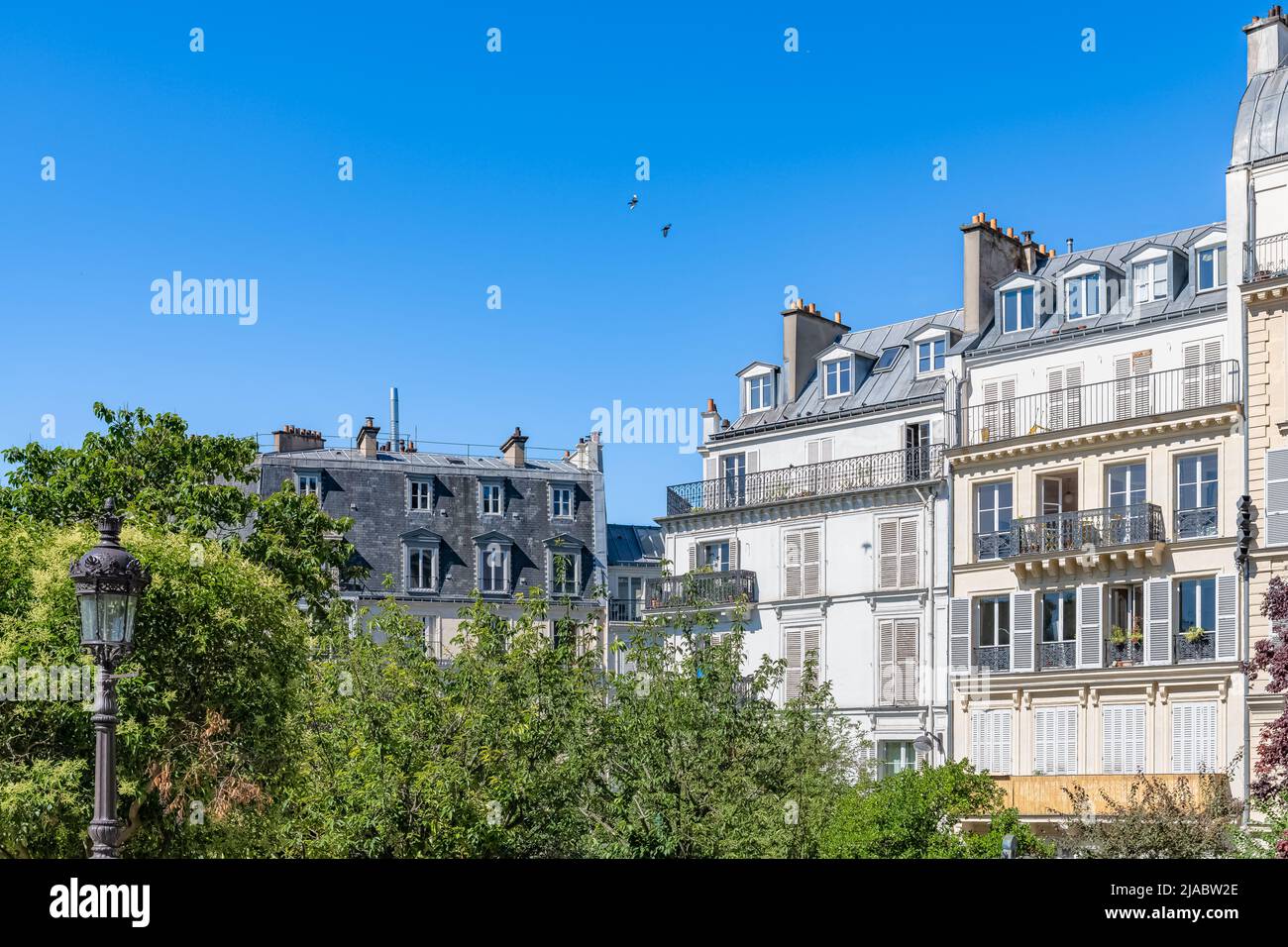 Paris, typical facades, beautiful buildings with old zinc roofs, rue ...