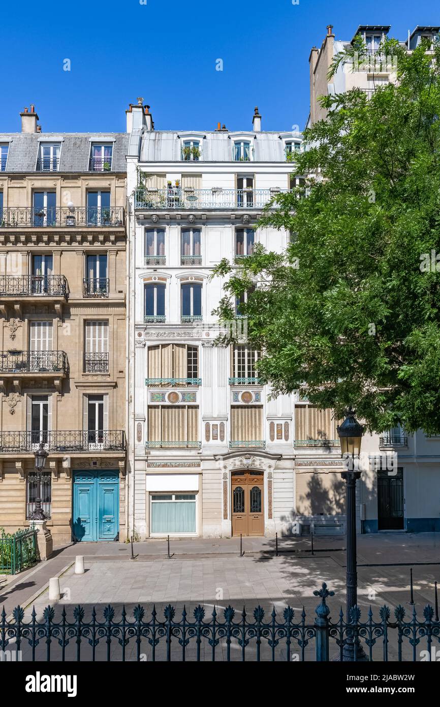 Paris, typical facades, beautiful buildings with old zinc roofs, rue ...