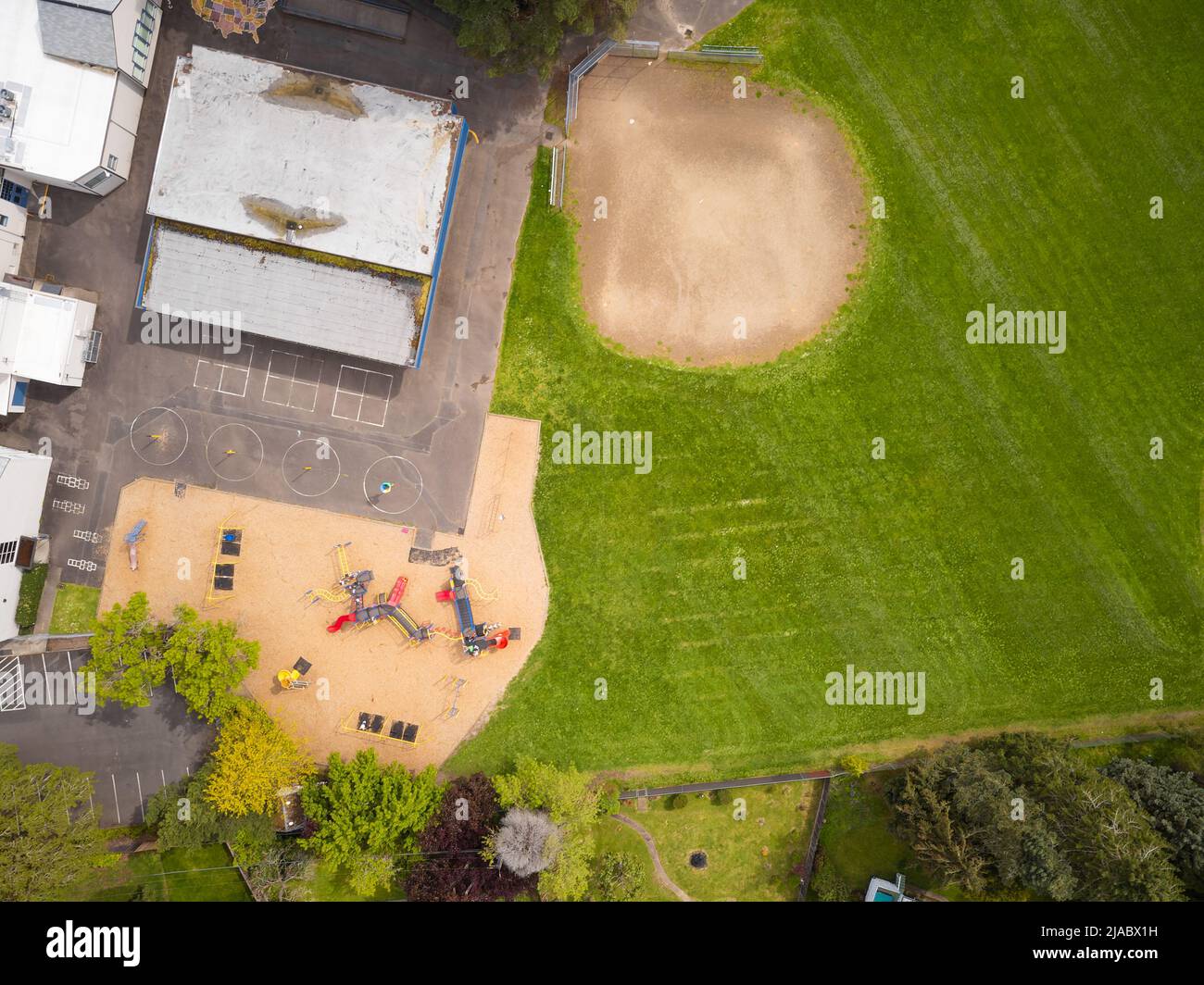 Shot from the air. Residential houses in a small town, suburb. Green ...