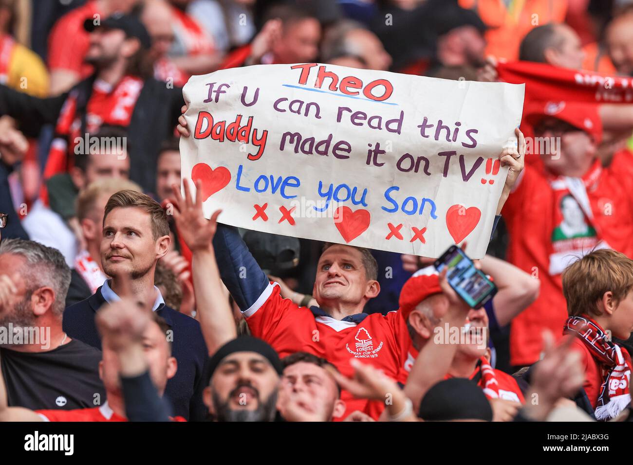 A fan holds up a poster after Forest are promoted to the Premier League ...