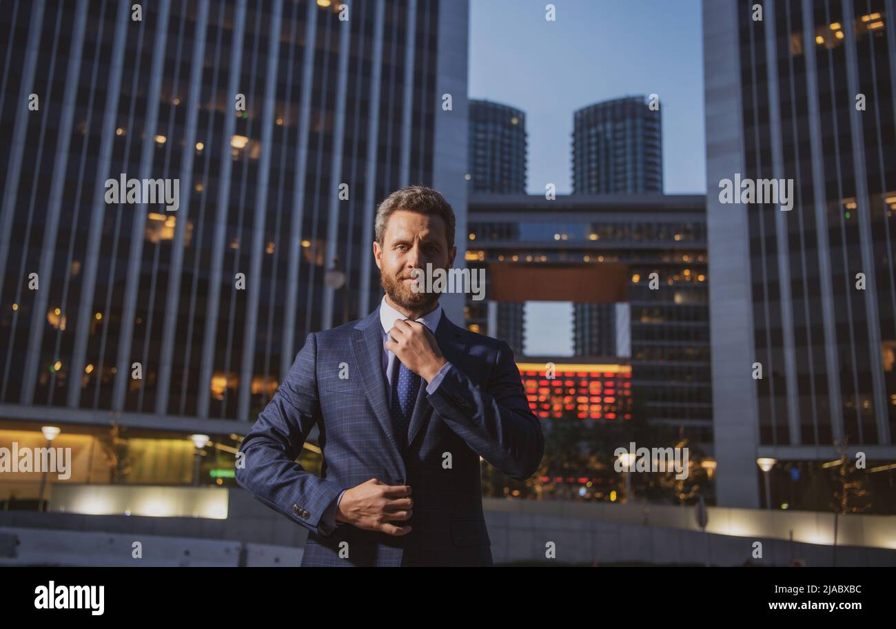 Business man stand up and night city background Stock Photo - Alamy
