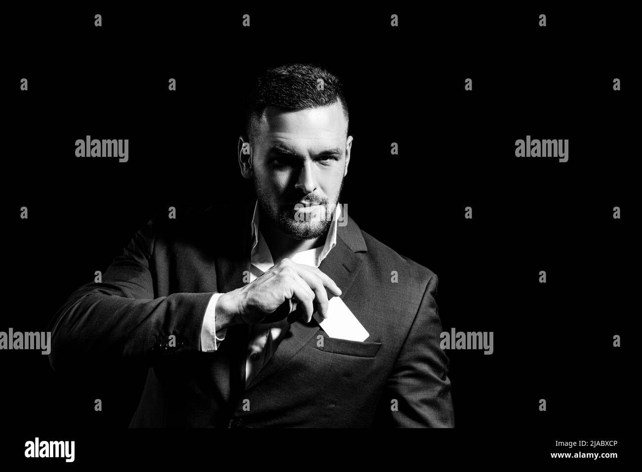 Businessman paying credit card Black and White Stock Photos & Images ...