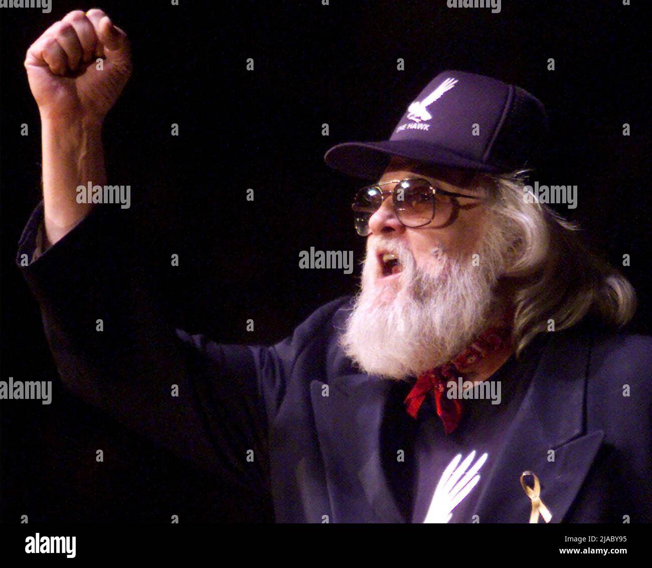 Canadian music legend Ronnie Hawkins raises his fist while he performs ...