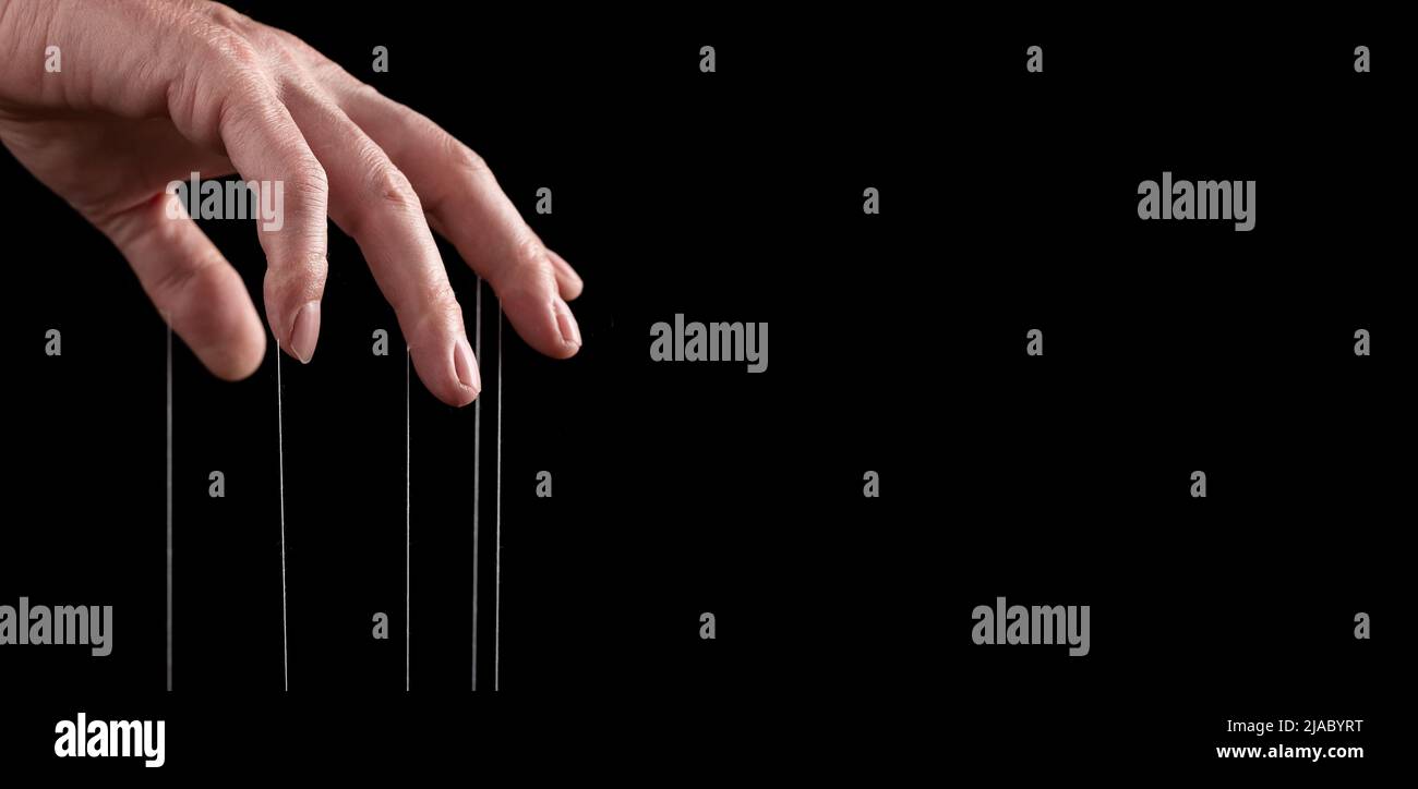 Banner with man hand with strings on fingers. Manipulation or addiction ...
