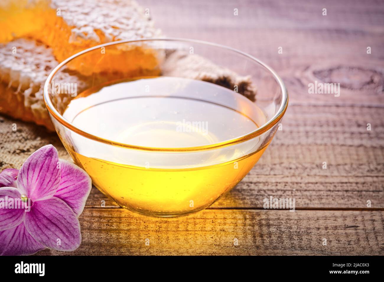 Honey background. Honey with wooden honey dipper on wooden table Stock ...