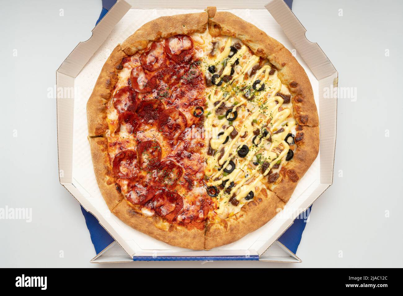 Delicious looking pepperoni pizza and combination pizza Stock Photo - Alamy