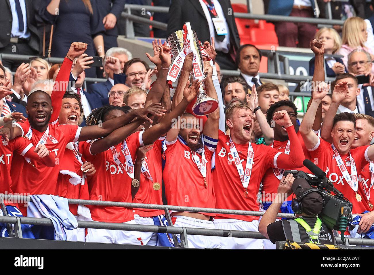 Lewis Grabban #7 of Nottingham Forest lifts the cup as Forest are ...