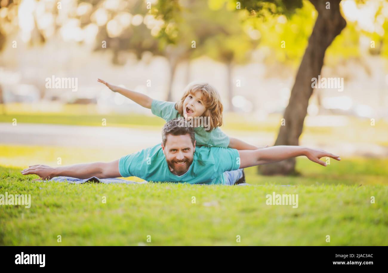 Childhood and parenthood kids concept. Happy father and son playing ...