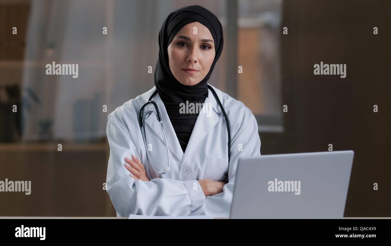 Happy smiling arabian nurse islamic doctor therapist wear white uniform ...