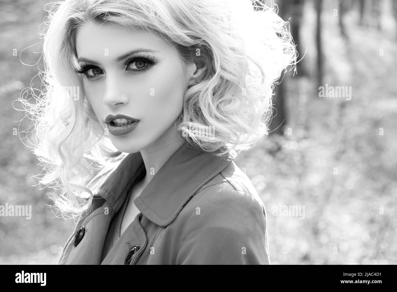 Close up portrait of a beautiful and young woman enjoying sunny day ...