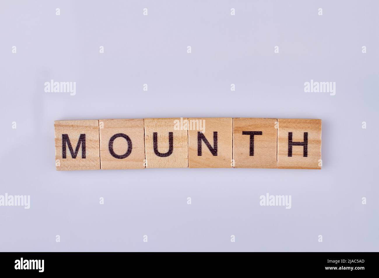 Month word written on vintage wooden blocks. Isolated on white ...