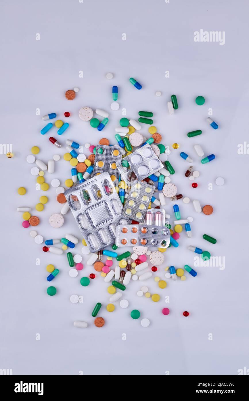 Assorted medical tablets and blisters isolated on white background. Top ...