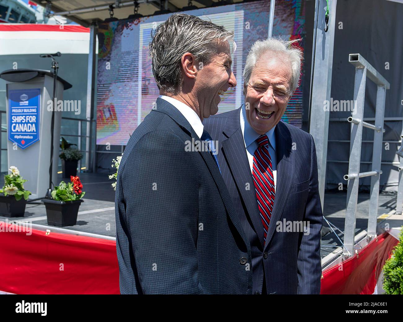 Jim Irving, right, co-CEO of J.D. Irving Ltd., chats with Premier Tim ...
