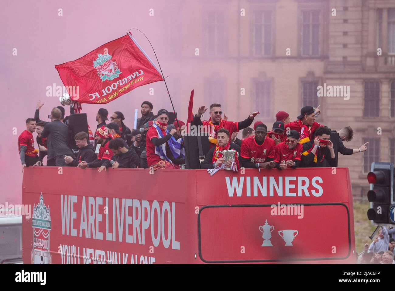 The Liverpool FC squad celebrate during the open top bus parade through ...