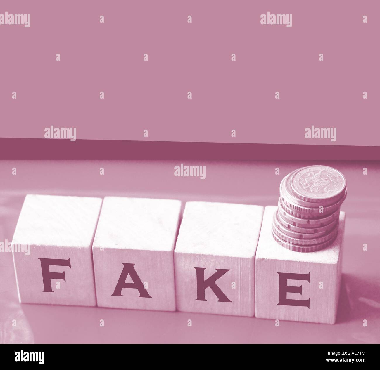 FAKE word written in wooden blocks on brown paper Stock Photo - Alamy