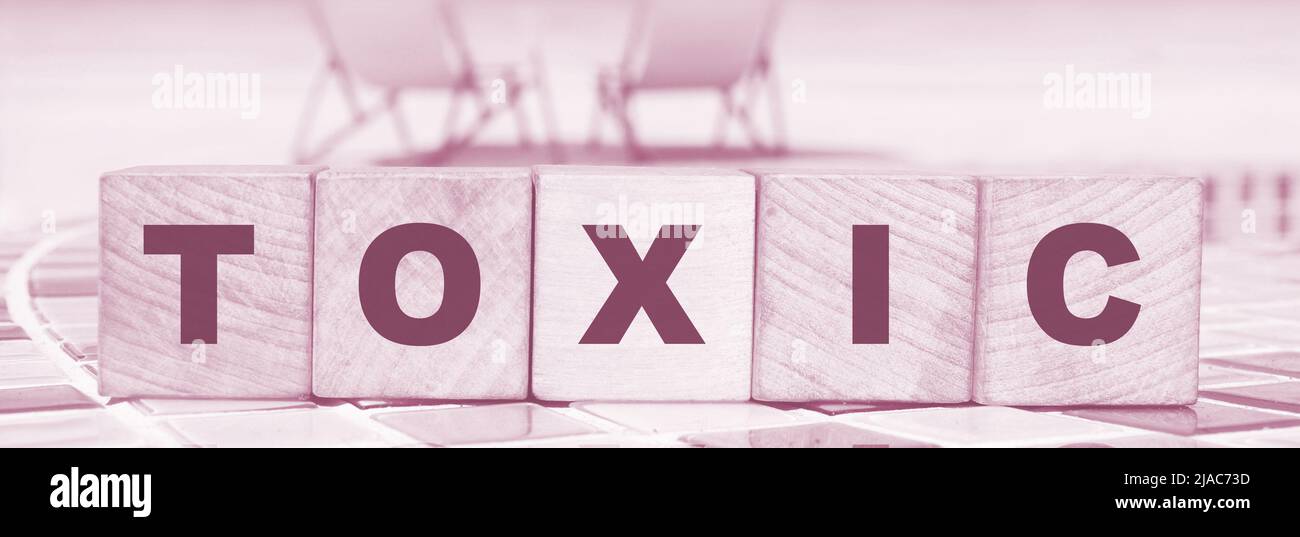 Toxic Word written on wooden cubes. Detox intoxication rehab stop ...