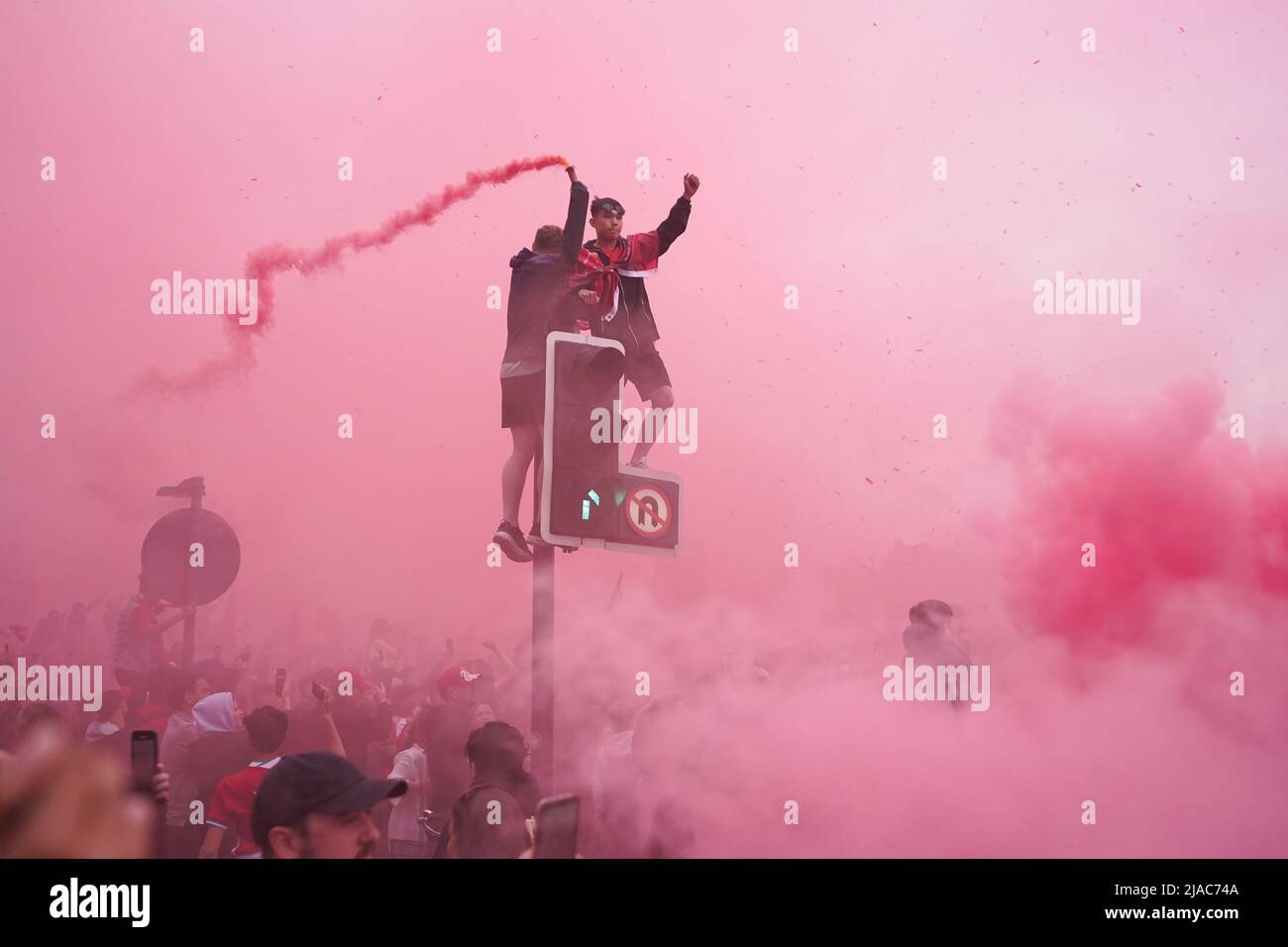 Liverpool fans set off pyrotechnics during the trophy parade in ...
