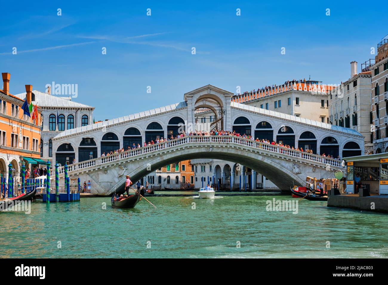 Rialto bridge with boats and gondolas. Grand Canal, Venice, Italy Stock ...