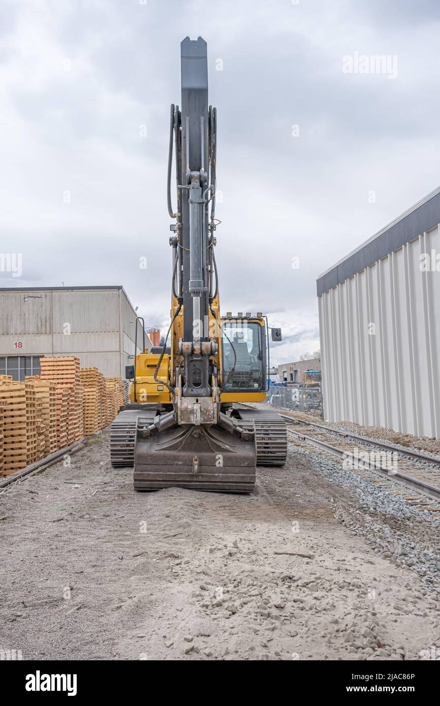 Excavator digging at contruction site for a new building Stock Photo ...