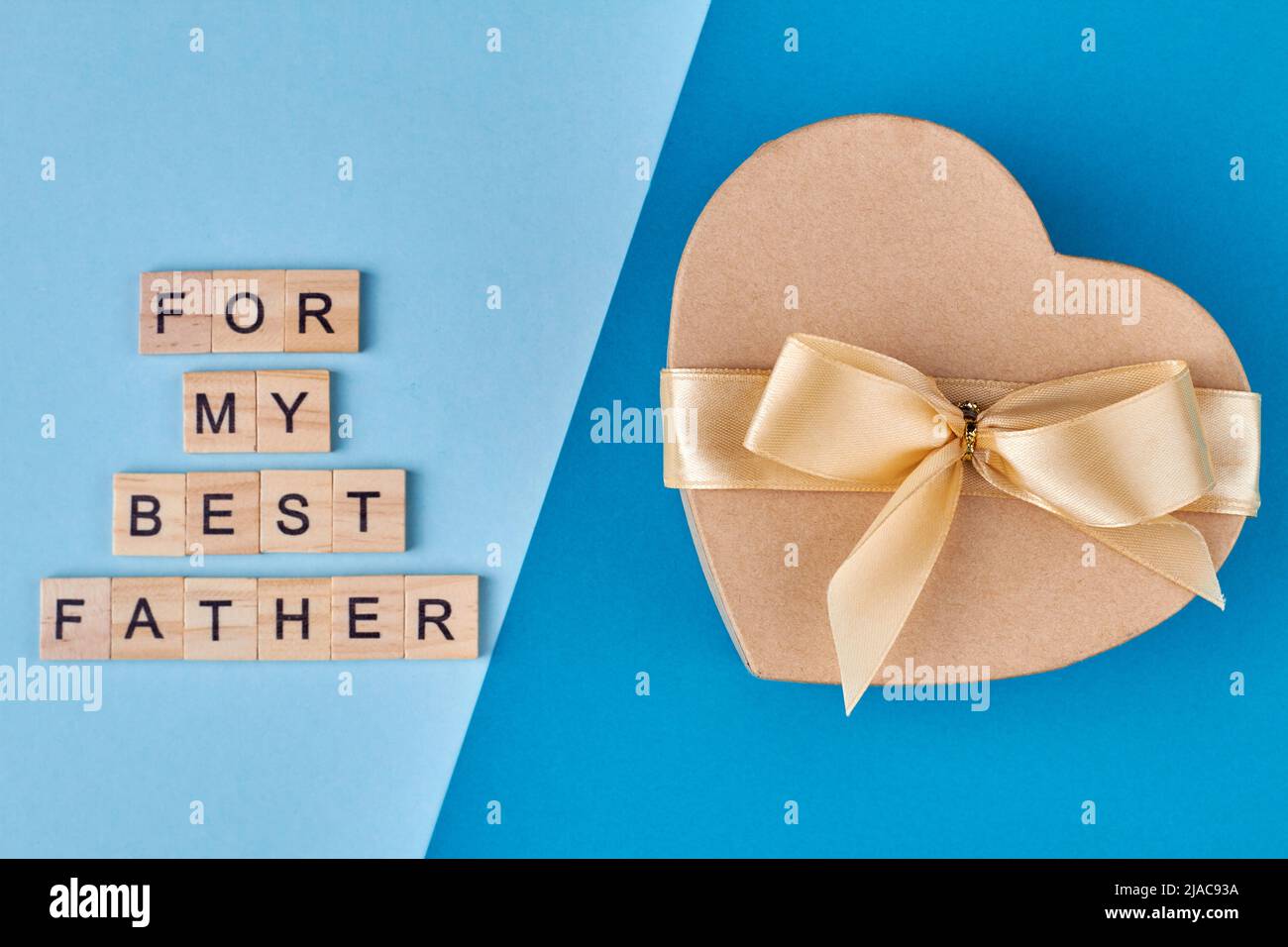 Heart-shaped gift box and wooden cubes with inscription For my best ...