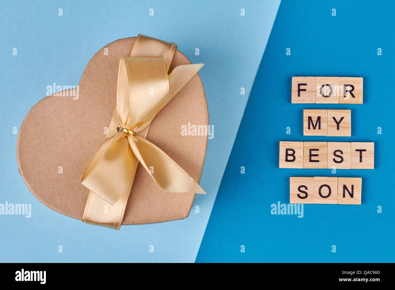 Heart-shaped gift box and wooden cubes with inscription For my best son ...