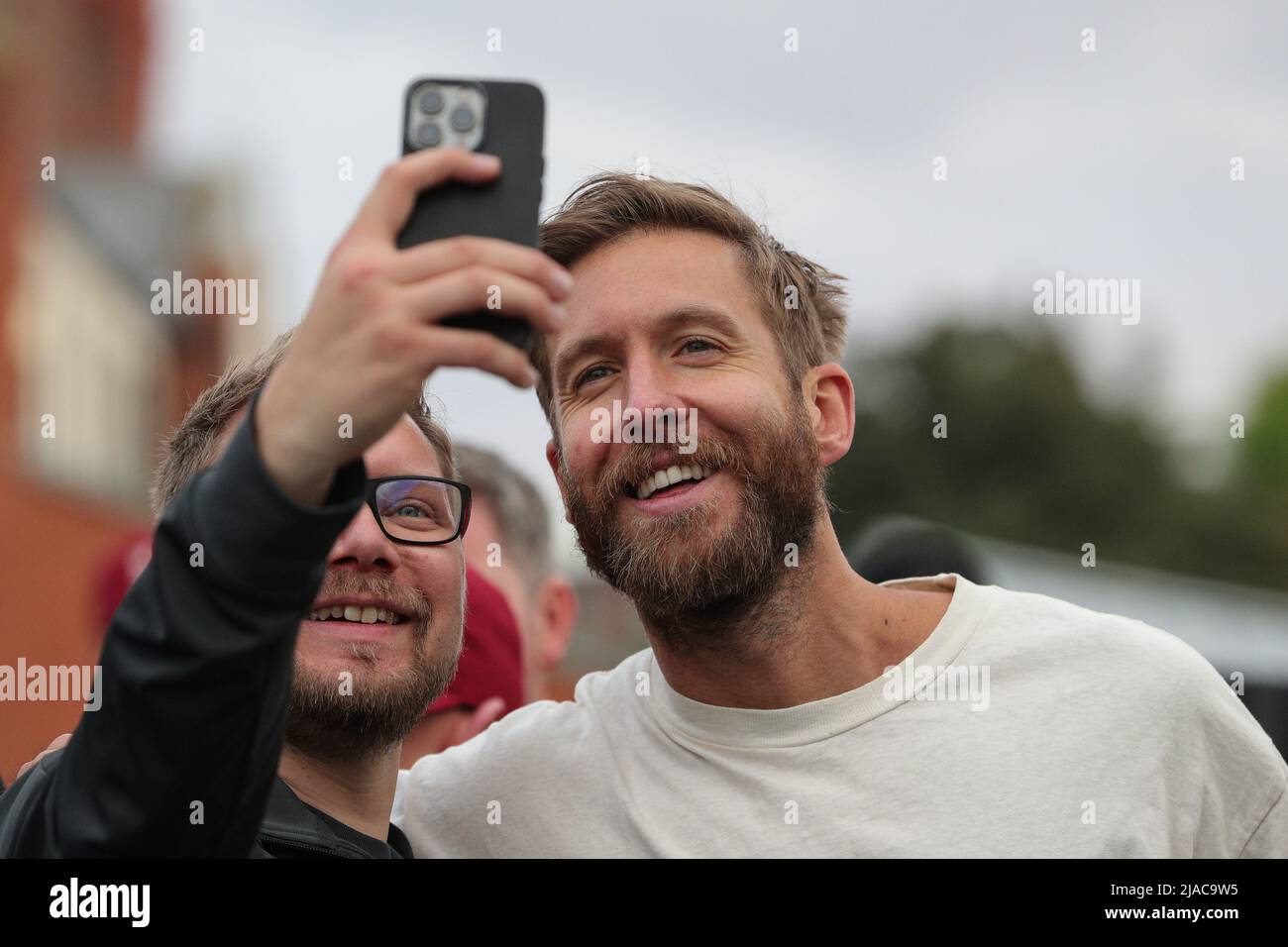 Scottish DJ Calvin Harris has his picture taken with fans as he ...