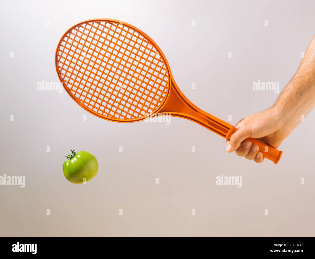 Hand holding tennis racquet hi-res stock photography and images - Alamy