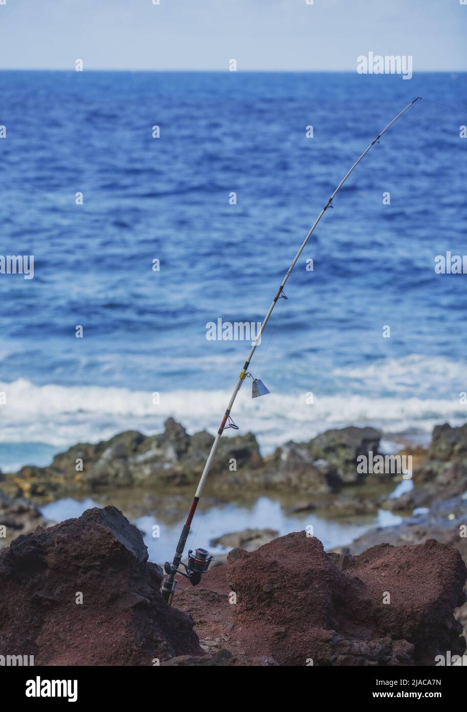 Deep see fishing at sea bech. Fishing rod background Stock Photo - Alamy