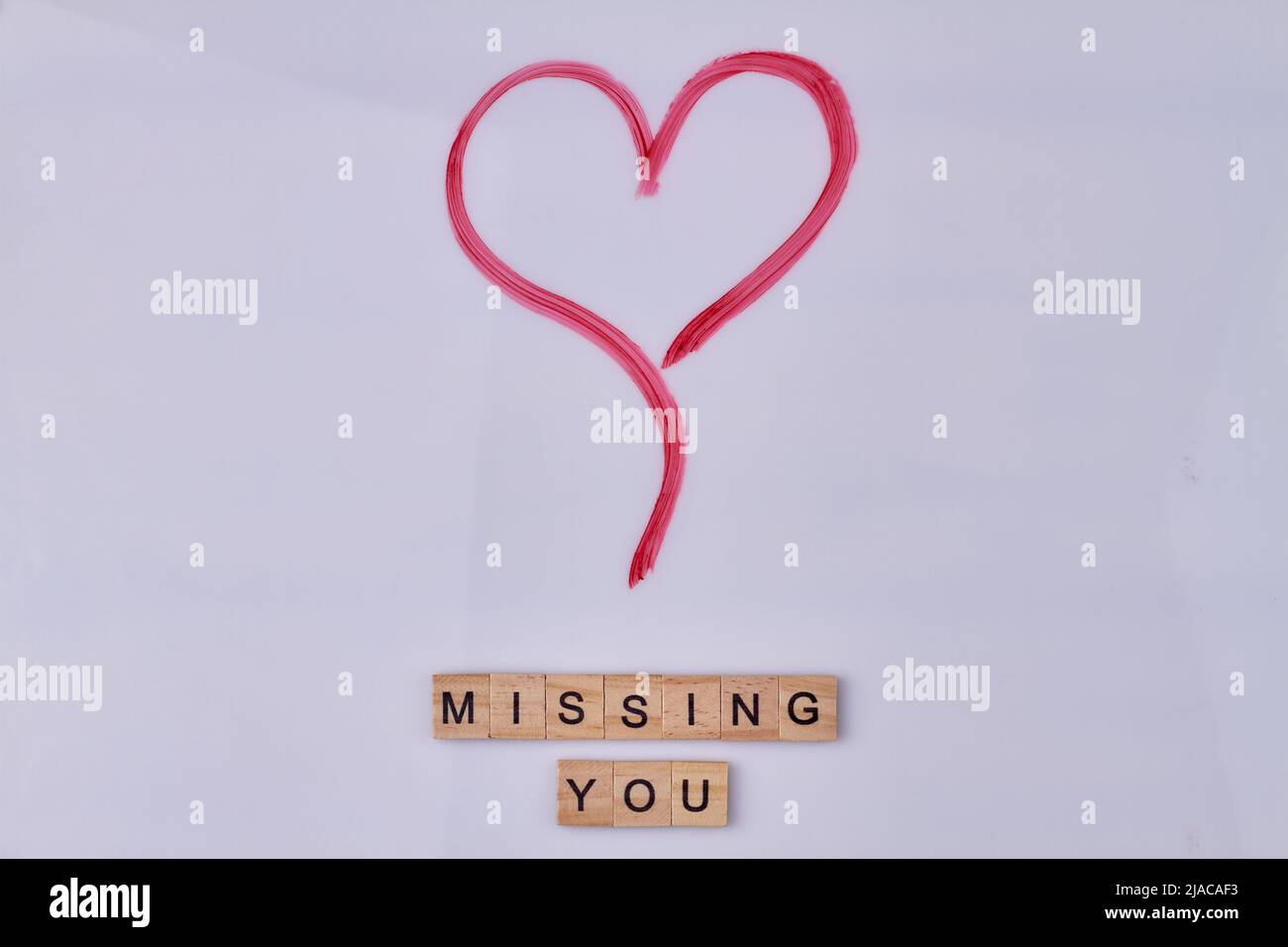 Red hand drawn heart and inscription missing you on vintage wooden ...