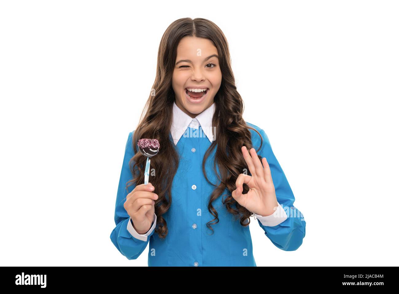 sweet tooth. yummy. girl isolated on white. ok. winking child with ...