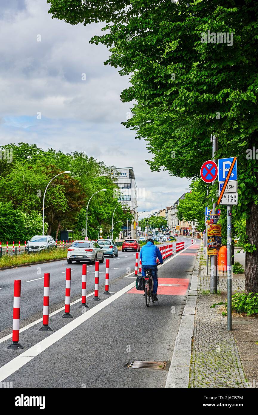 Berlin, Germany - May 29, 2022: Cyclist in a dedicated cycle lane on a ...
