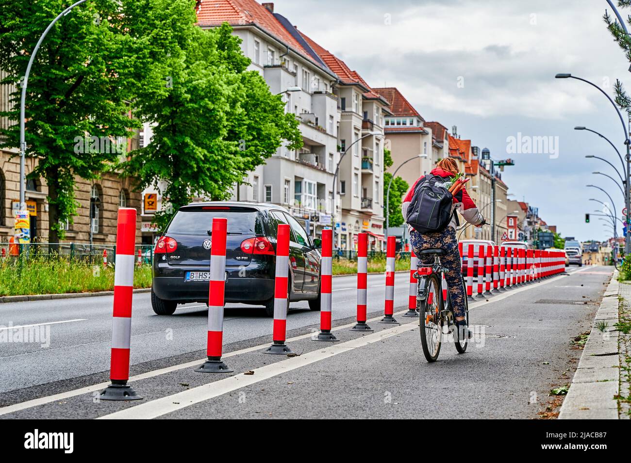 Berlin, Germany - May 29, 2022: Cyclist in a dedicated cycle lane on a ...