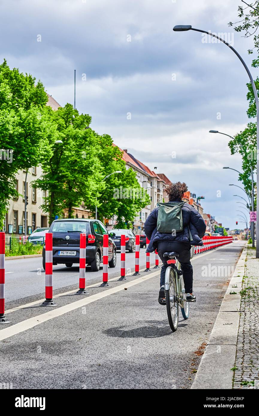 Berlin, Germany - May 29, 2022: Cyclist in a dedicated cycle lane on a ...