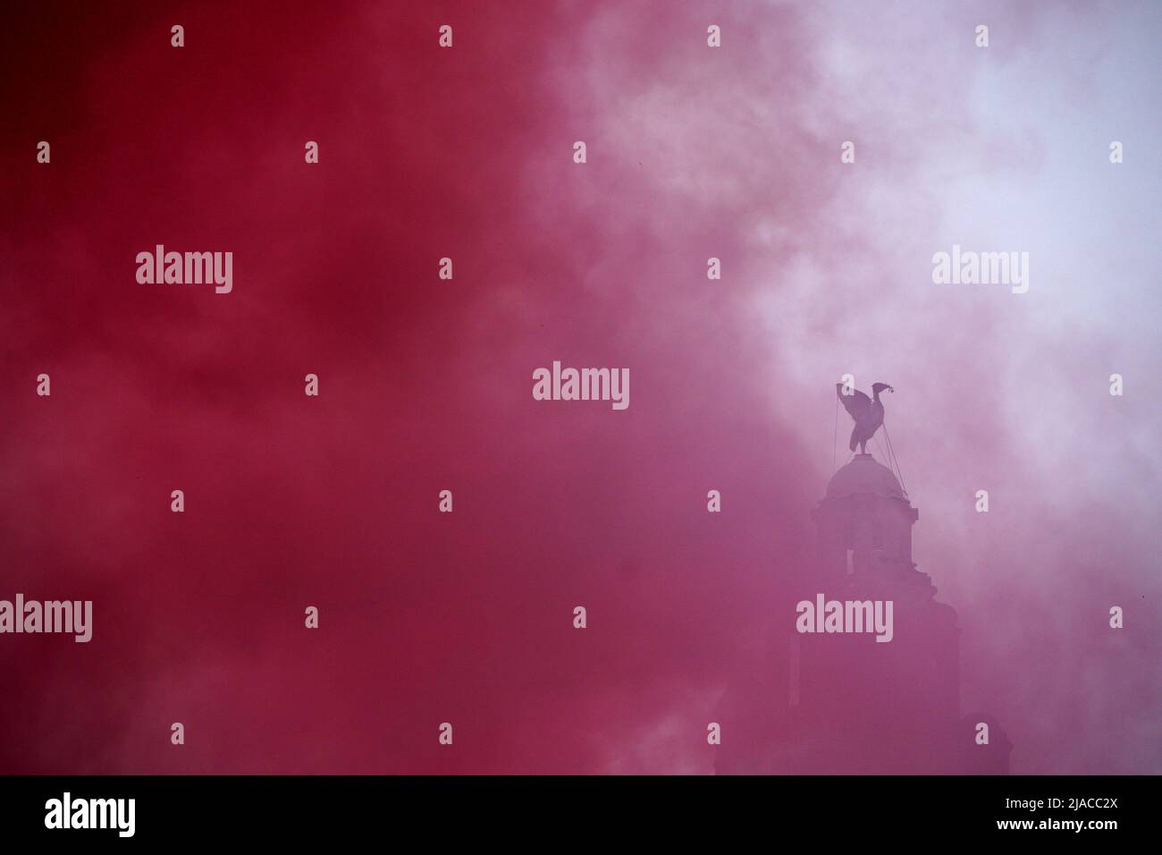 Red smoke from pyrotechnics fills the air during the trophy parade in ...