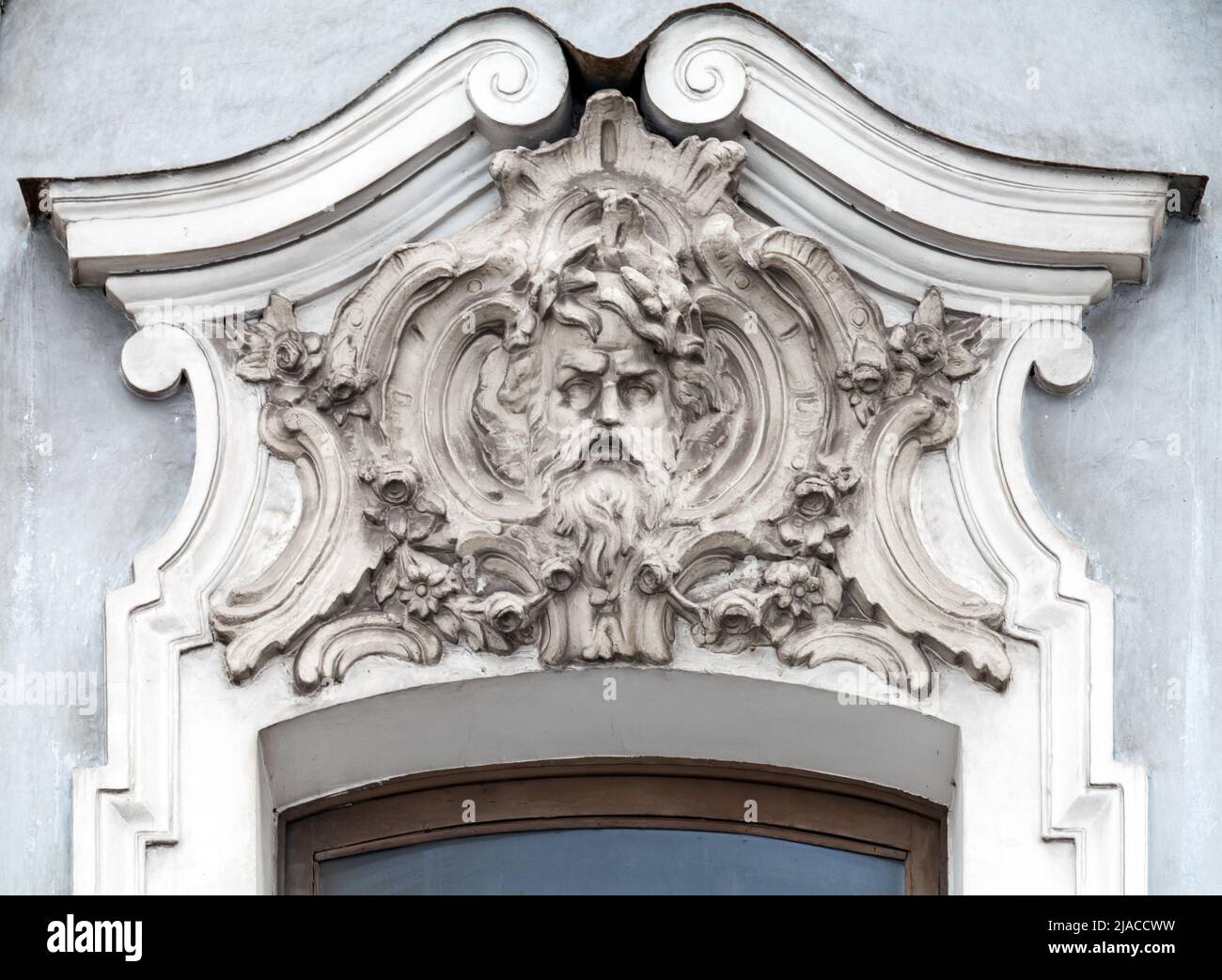 White sculpture decoration of a window frame. Classic architecture of ...
