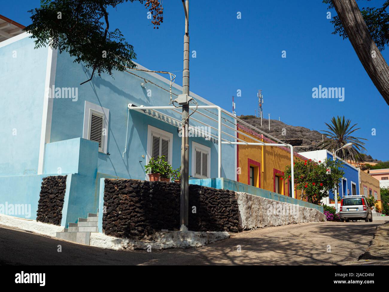 View of a typical colorful houses in the street of Linosa, Sicily ...