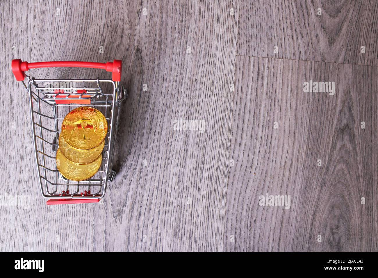 Bitcoin coins in a shopping cart, E-commerce concept, copy space Stock ...