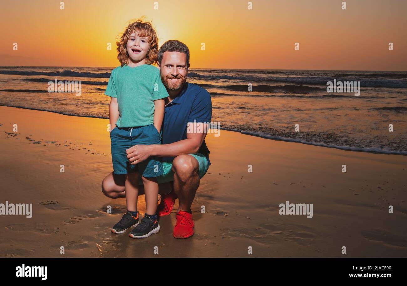 Father and son hugging on beach sunset. Dad and his little boy are ...