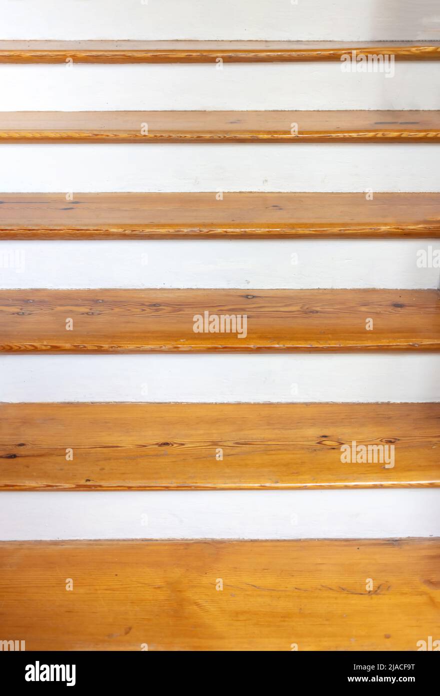 Vintage wooden stair with brown plank tread and white riser. Interior ...