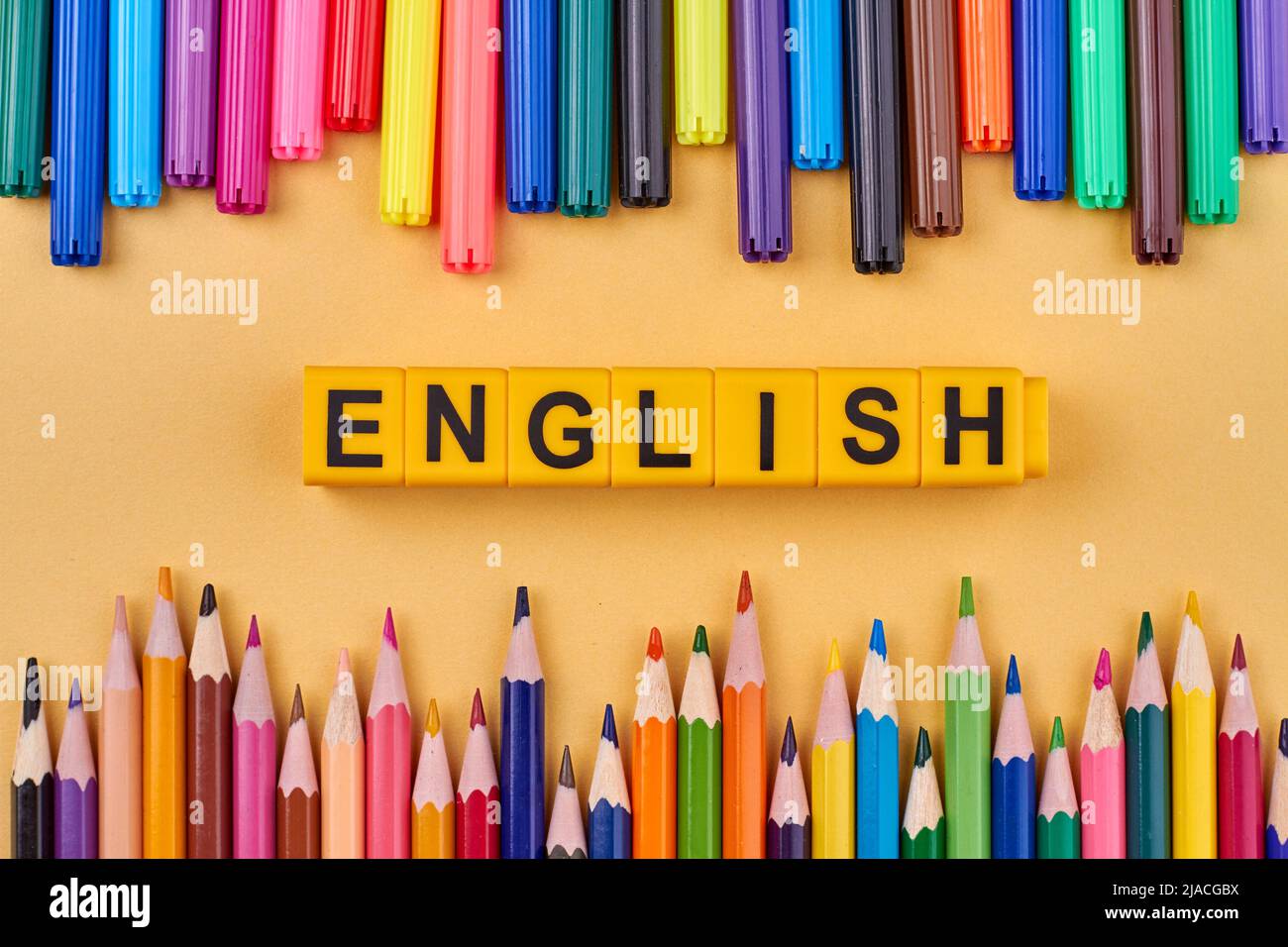 The word ENGLISH written on plastic cubes in frame from colored school ...