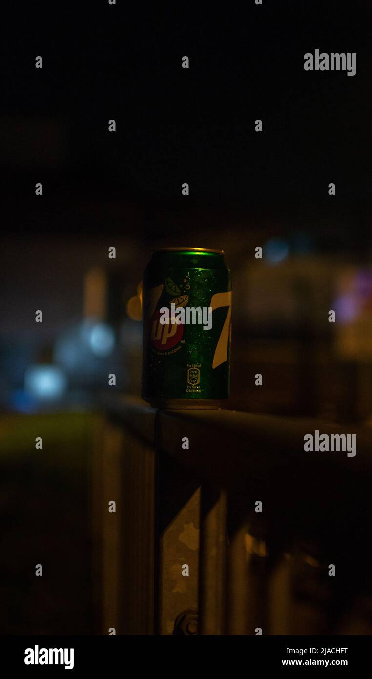 Sevenup / 7up can, sat on a railing by the side of a busy road Stock ...