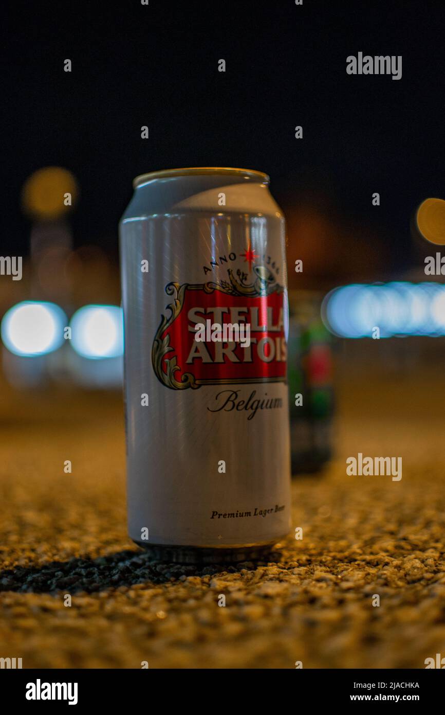 Can of Stella Artois on a bench, with a super- shallow depth of field ...