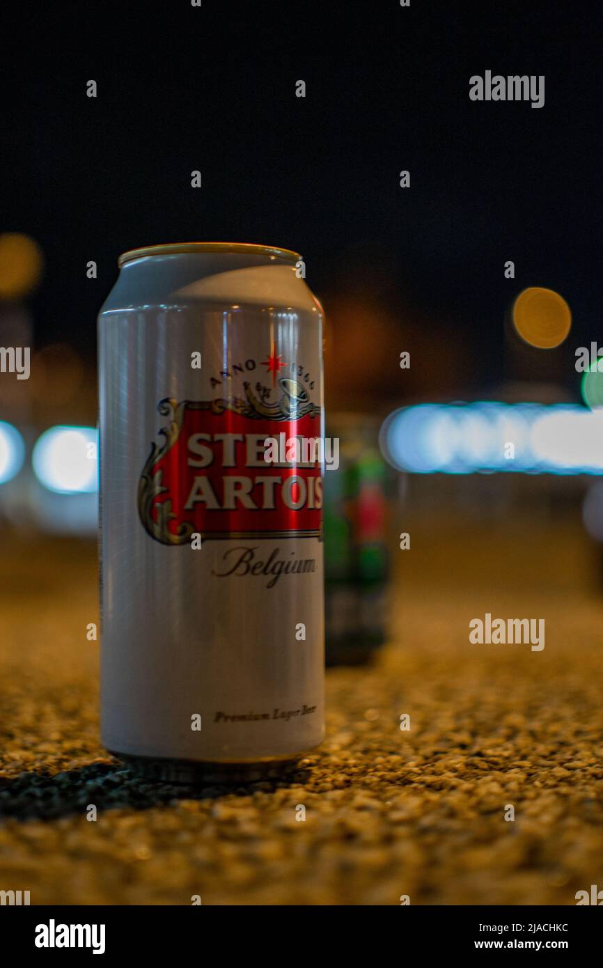 Can of Stella Artois on a bench, with a super- shallow depth of field ...