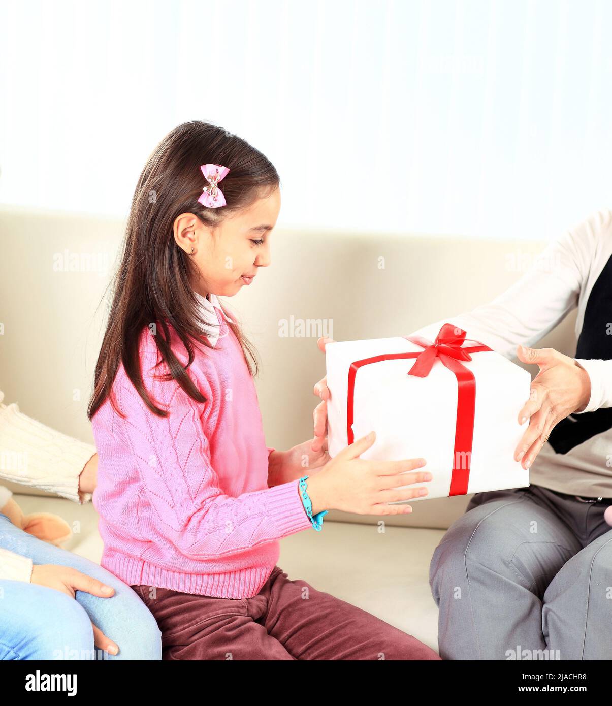 Little beautiful pretty girl giving a gift to her happy mother Stock ...