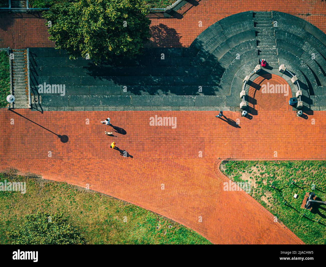 Aerial view of pedestrians in small park Stock Photo - Alamy