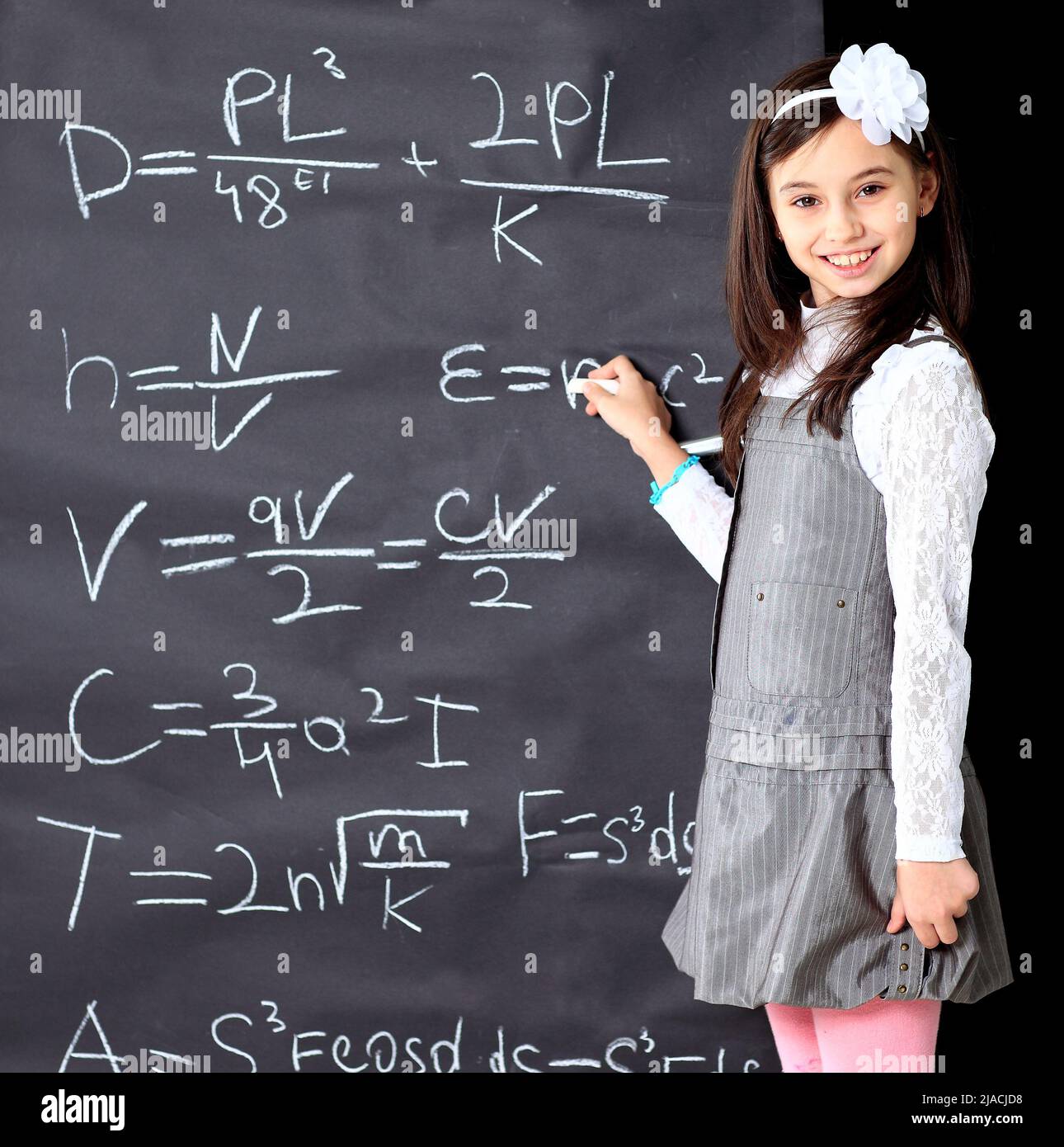 The little girl decides to mathematical equations Stock Photo - Alamy
