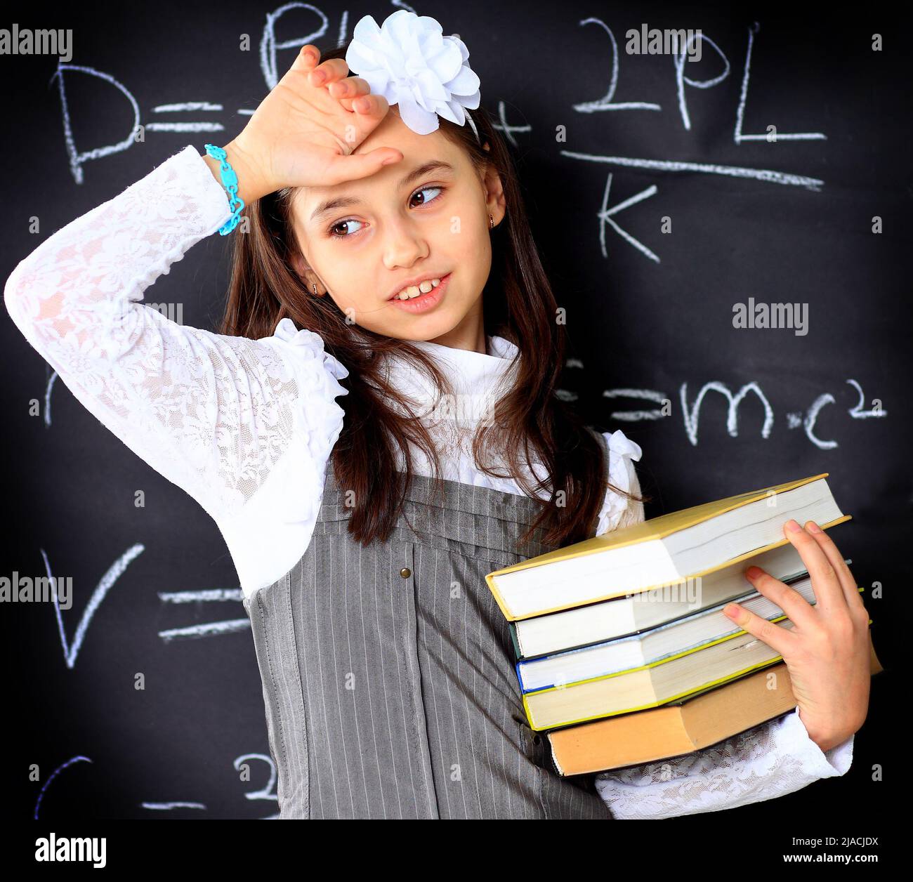 The little girl decides to mathematical equations Stock Photo - Alamy